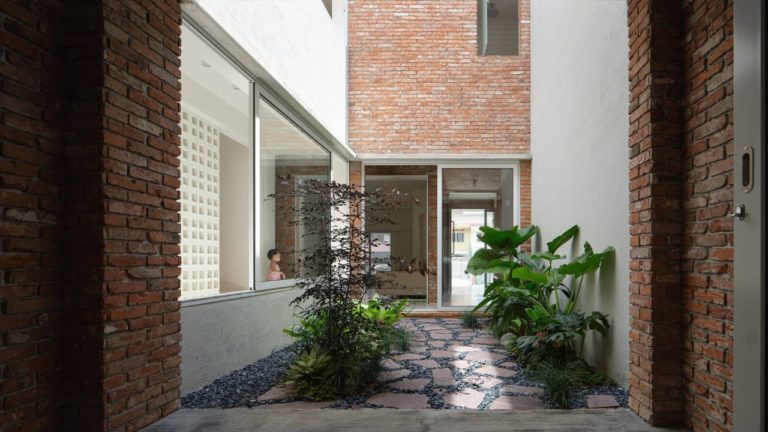 Inside A Light-Filled Red Brick Home With An Open Airwell